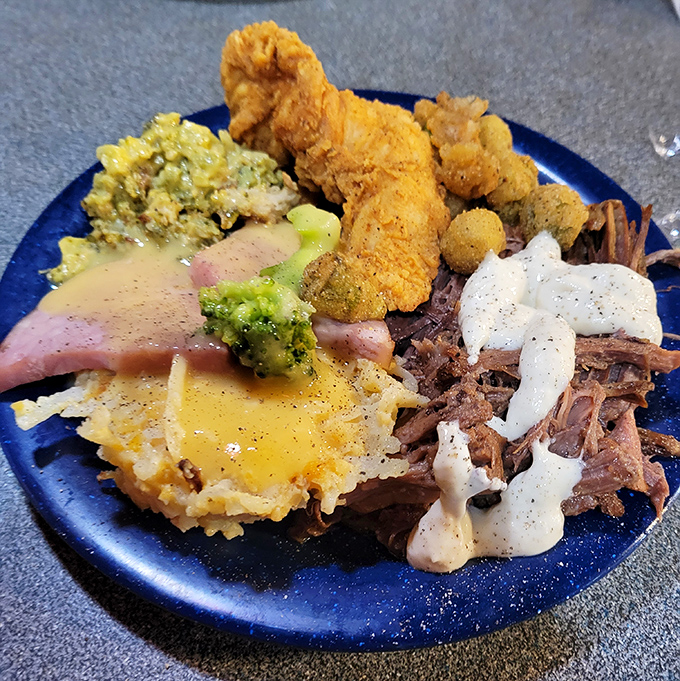 The art of buffet plate architecture on full display&mdash;a masterpiece of portion control defiance featuring at least three different proteins.