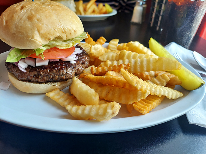 The classic American burger and fries – proof that sometimes the simplest pleasures, executed with care and quality ingredients, are the most satisfying.