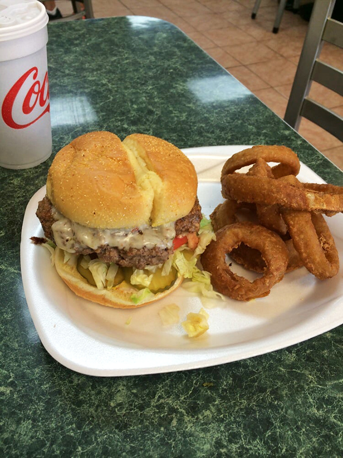 The classic American duo&mdash;burger and rings&mdash;sitting pretty on a plate. Some relationships are just meant to be.