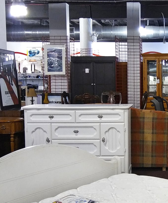 That pristine white dresser is mid-century magic waiting for a new home. Furniture this solid wasn't built for landfills.