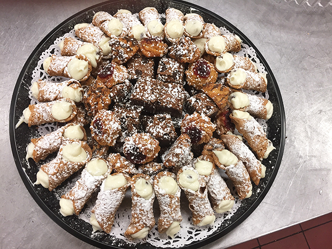 The grand finale: a platter of cannoli with crisp shells and creamy filling &ndash; the Italian-American dessert that makes you save room no matter how much pizza you've eaten.