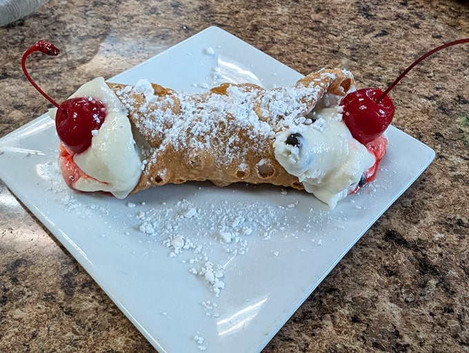 The cannoli&mdash;a sweet finale that whispers, "See you again soon." Crisp shell, creamy filling, and those cherries are just showing off.