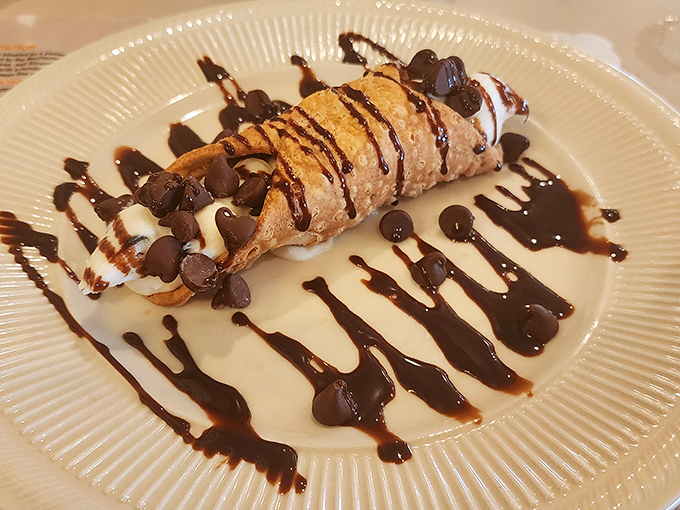 The cannoli&mdash;crisp shell, sweet filling, chocolate chips, and a drizzle that makes you wonder why you'd ever waste calories on lesser desserts.