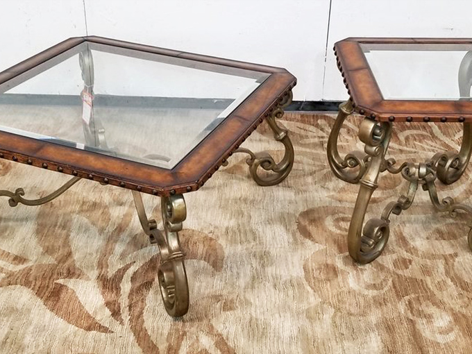 These glass-topped tables with ornate metal bases aren't just furniture&mdash;they're conversation pieces that say "Yes, I have excellent taste" without you having to say a word.
