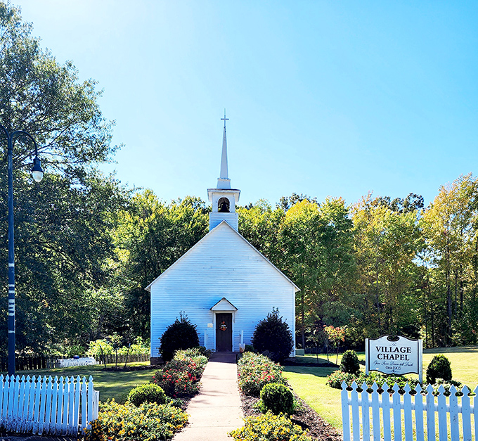 The pristine white chapel stands as a testament to simpler times, when Sunday services and railroad schedules were the rhythms that governed small-town life.