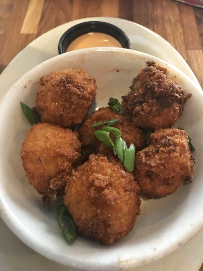 Golden-fried cheese balls that make a compelling argument for spherical food being superior to all other shapes. Crispy outside, gooey inside—geometry never tasted so good.