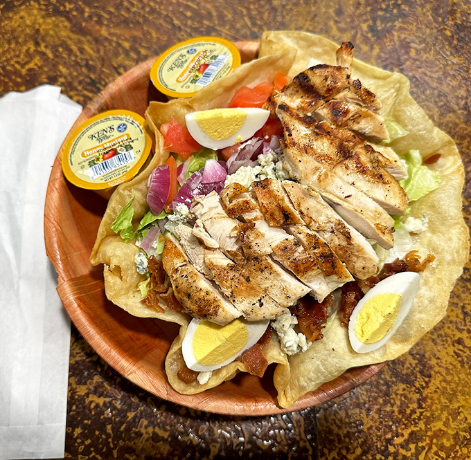 This chicken taco salad proves healthy-ish options can still be indulgent &ndash; grilled chicken, fresh vegetables, and enough cheese to remind you you're still in a tavern.