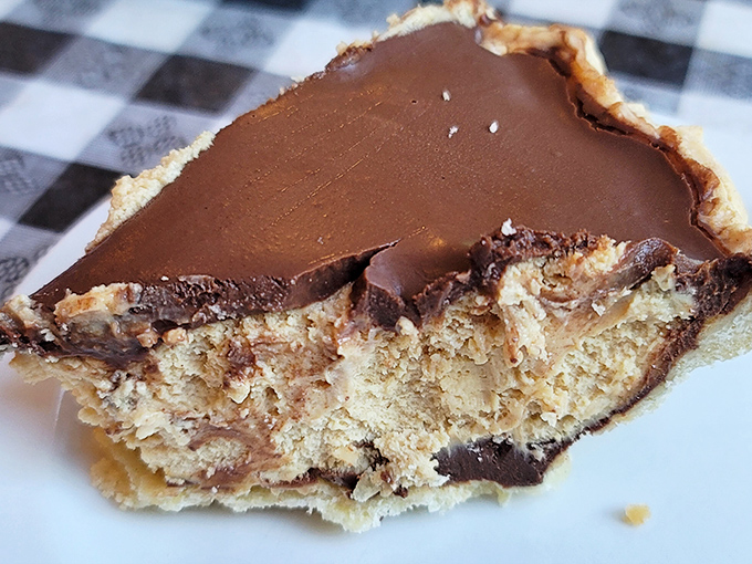 That chocolate peanut butter pie looks thick enough to require a construction permit and rich enough to solve world peace.