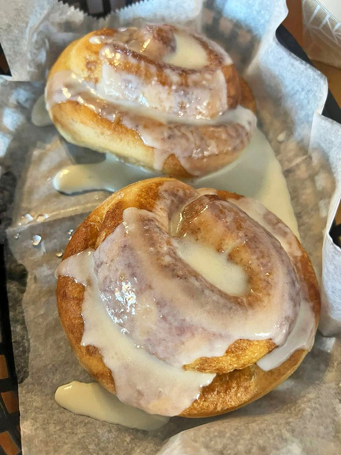 Cinnamon rolls drowning in sweet glaze that would make your grandmother both impressed and slightly jealous of their perfect swirl.