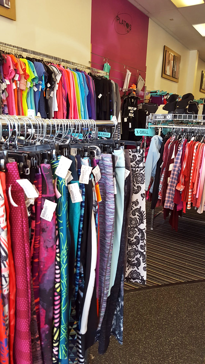 A rainbow of options lines these racks, proving that sustainable fashion comes in every color of the style spectrum.