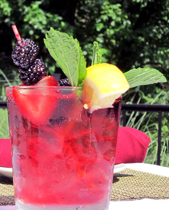 Summer in a glass&mdash;berries, mint, and citrus come together in this cocktail that's basically a vacation you can sip through a straw.