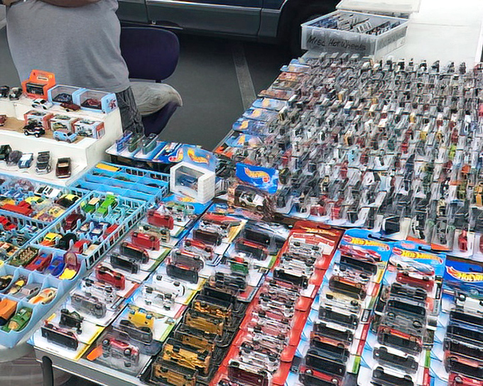 Childhood dreams, perfectly preserved. These miniature Hot Wheels create a rainbow of automotive nostalgia that transcends generations.