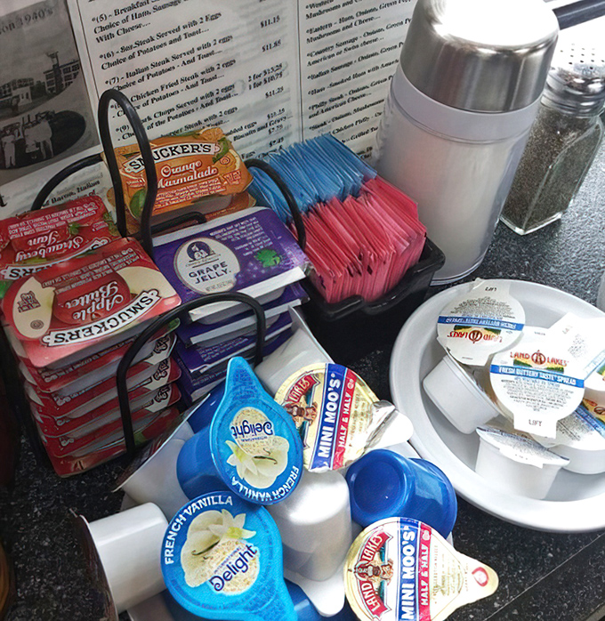 The condiment caddy&mdash;civilization's greatest achievement. These humble packets and creamers are the supporting cast that turns good meals into personal masterpieces. 