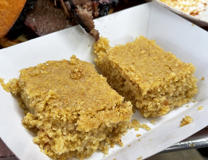 Sweet potato cornbread squares that straddle the line between side dish and dessert. The perfect supporting actor to smoky meats.