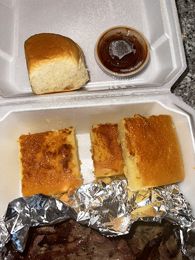 Even the takeout presentation shows attention to detail—cornbread and sauce packaged separately to maintain perfect texture until you're ready to dig in.