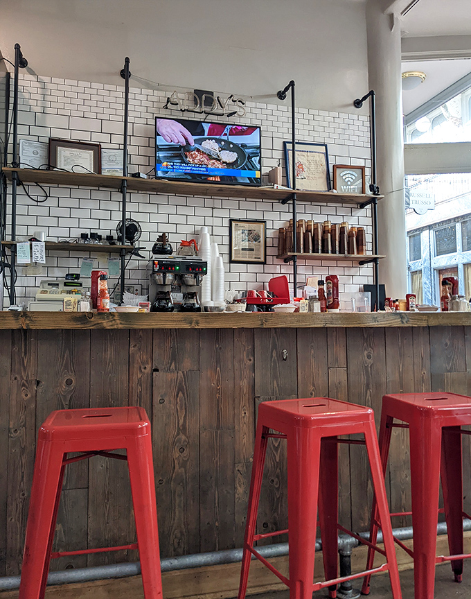 Industrial-chic meets breakfast bar&mdash;those red stools aren't just seating, they're front-row tickets to the greatest morning show in Cleveland.