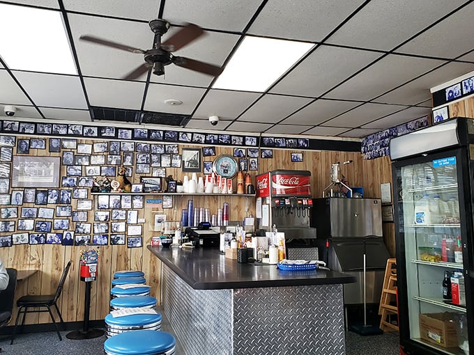 Blue counter stools lined up like eager students on the first day of school, ready to support the weight of both customers and their breakfast expectations.