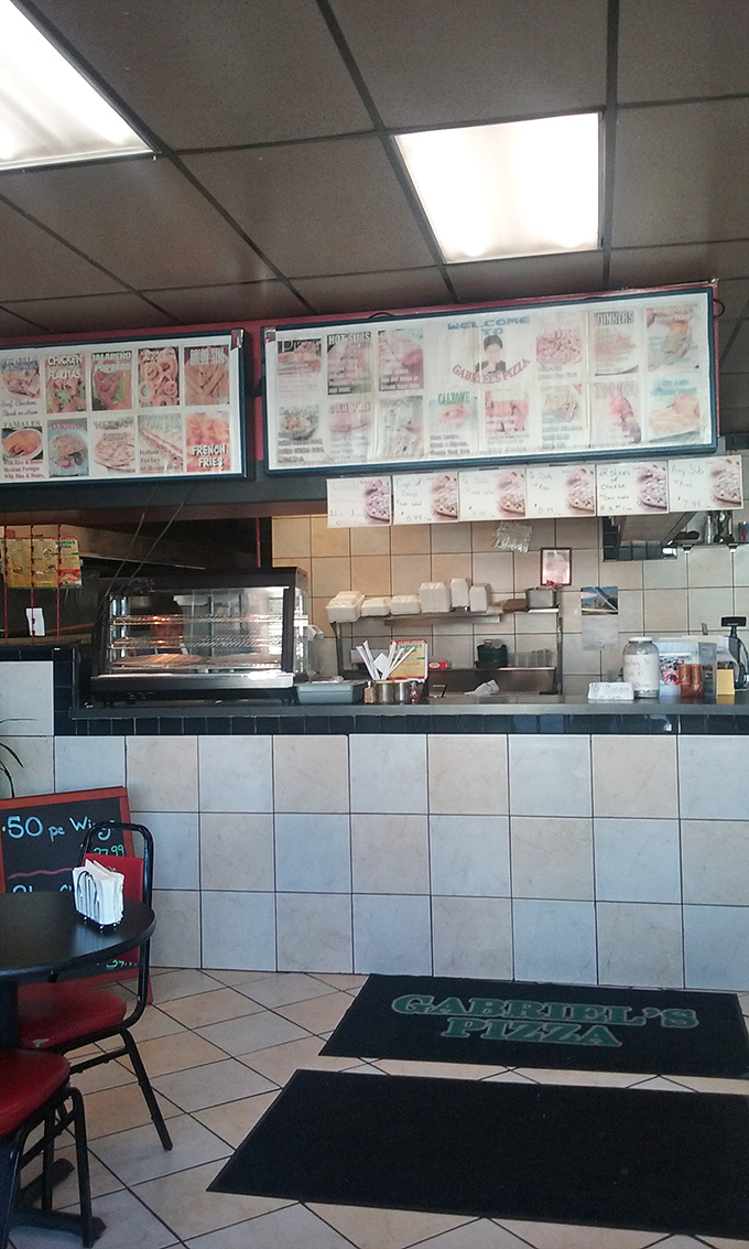 The counter where dreams come true. Behind that tile facade lies the kitchen that's cranking out everything from pizza to that legendary taco salad.
