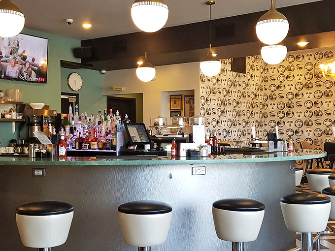 The bar area doesn't just serve drinks&mdash;it serves as the heart of the restaurant, complete with stylish stools that invite you to stay awhile.
