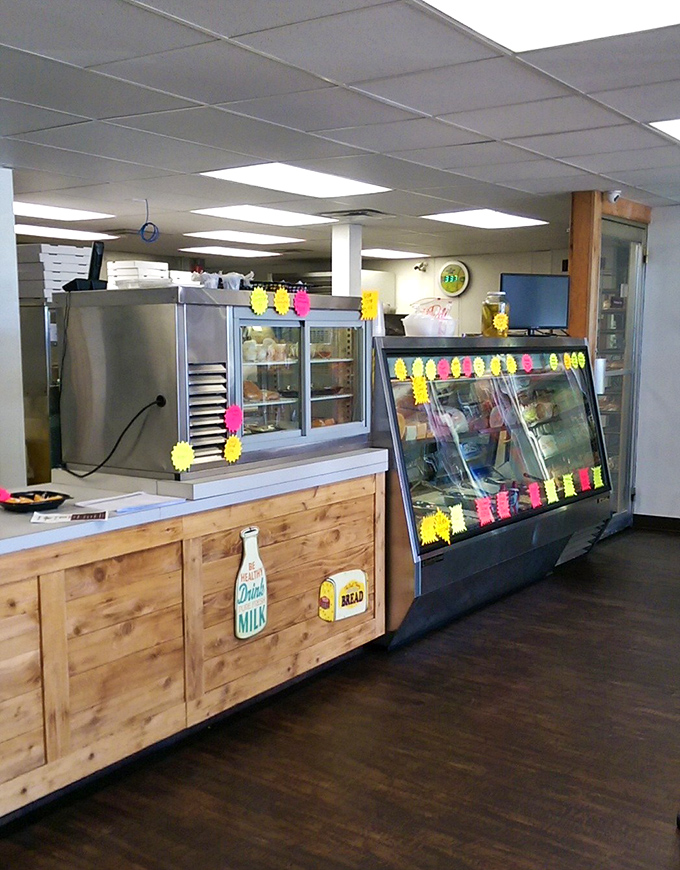 A bakery counter that whispers sweet promises of homemade treats. Those neon price tags aren't just markers—they're beacons guiding you toward happiness.