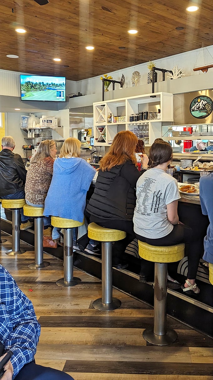 The counter seats: where solo diners become family and the kitchen's symphony unfolds before your eyes.