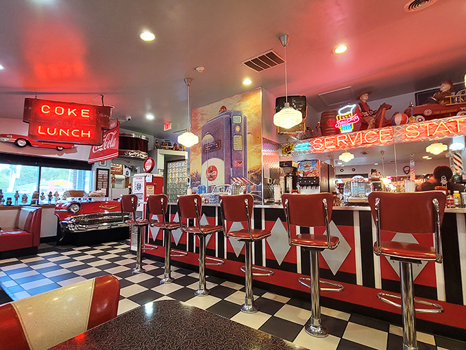 Counter seating where solo diners become temporary family, watching short-order ballet under the glow of vintage signs and pendant lights.