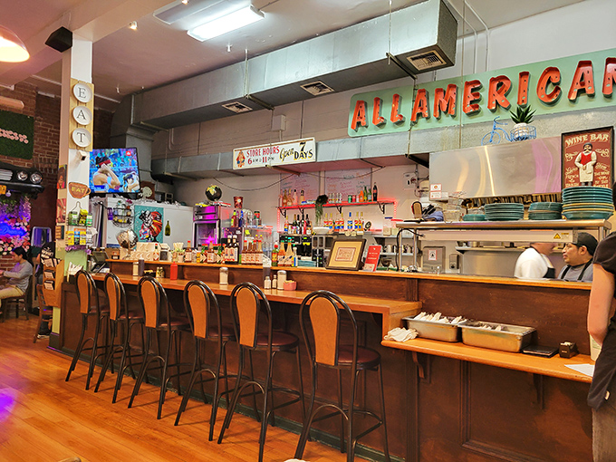 The counter seating offers front-row tickets to the breakfast show, where coffee flows freely and regulars exchange knowing nods.