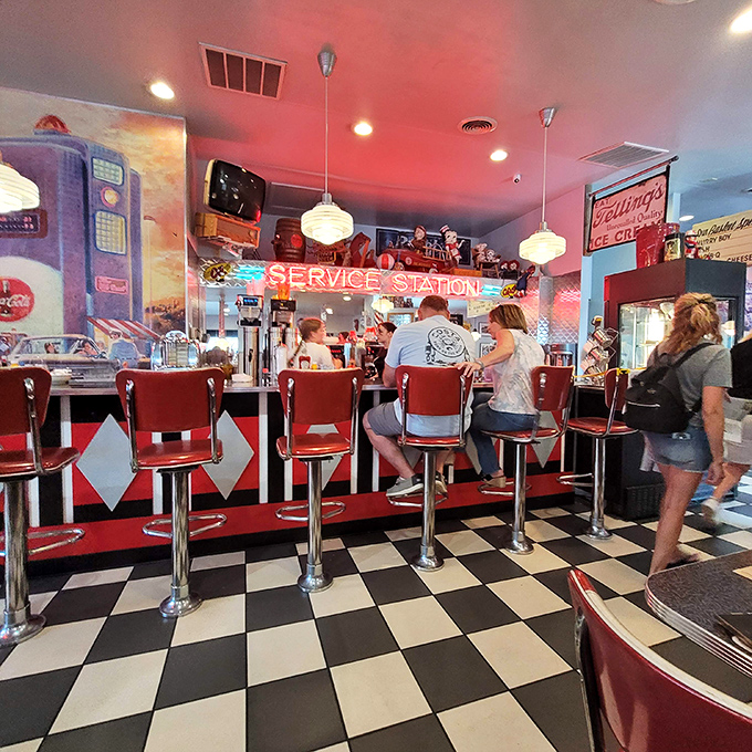 The counter seating isn't just dining&mdash;it's dinner theater where you can watch short-order magic happen while perched on those classic red vinyl thrones.
