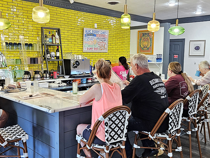 The vibrant counter area feels like breakfast's front row seats. Yellow brick walls that would make Dorothy forget all about Kansas.