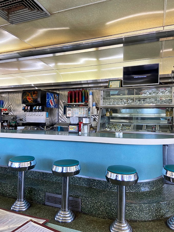 The counter seating—where solo diners become temporary family and the short-order ballet unfolds before your eyes. Front-row tickets to breakfast theater.