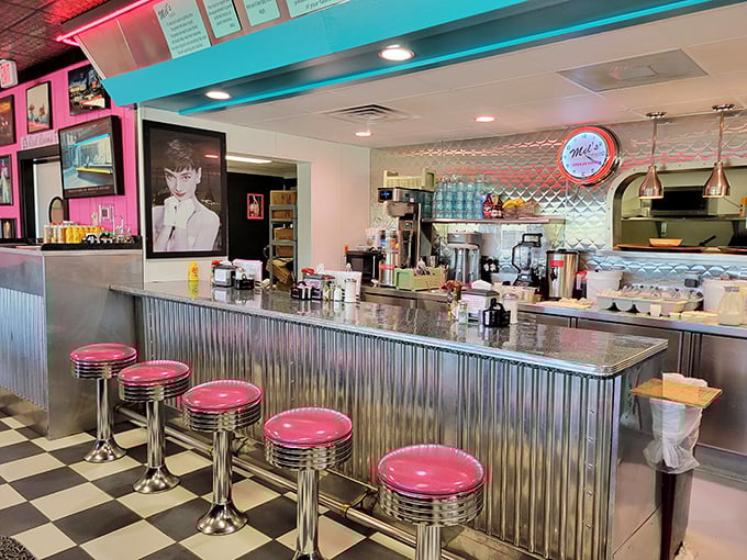 Pink stools lined up at the counter like soldiers ready for duty. This is where solo diners become regulars and servers become friends.