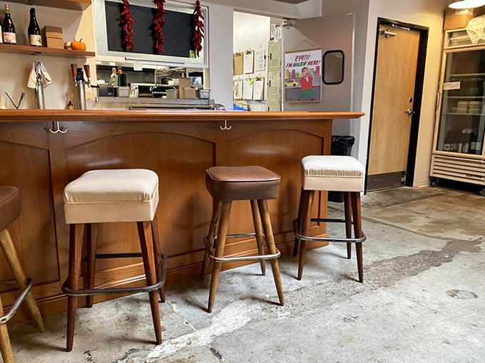 The counter seating offers front-row tickets to the culinary show, where mid-century bar stools invite you to settle in and stay awhile.