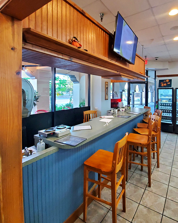 Counter seating: where solo diners become regulars, servers become friends, and the coffee is always within arm's reach.