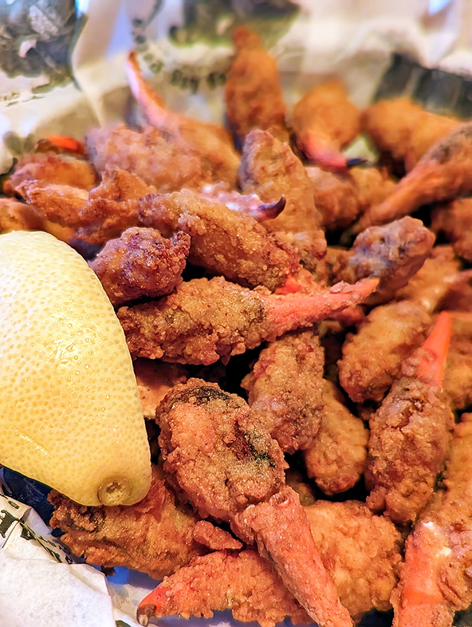 These golden-fried crab claws aren't just appetizers&mdash;they're edible treasure. The crunch gives way to sweetness that makes you forget your table manners entirely.