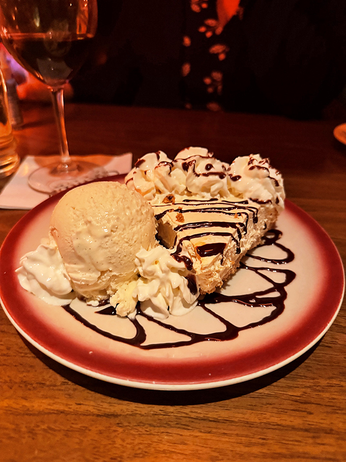 Cheesecake and ice cream sharing a plate like old friends catching up. The chocolate drizzle is their fascinating conversation you get to overhear.