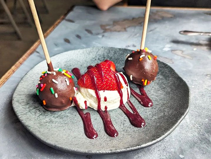 Dessert that doesn't just satisfy your sweet tooth&mdash;it entertains it. Chocolate cake pops and a strawberry that dressed up for the occasion.