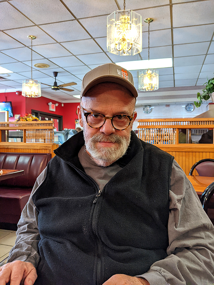 The interior reveals classic diner charm with wooden accents and vintage lighting. This is where memories are made, one plate of comfort food at a time.