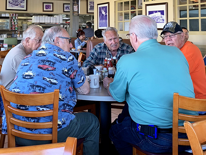 Where stories are shared over coffee cups that never seem to empty. These gentlemen aren't just eating breakfast—they're maintaining a tradition.