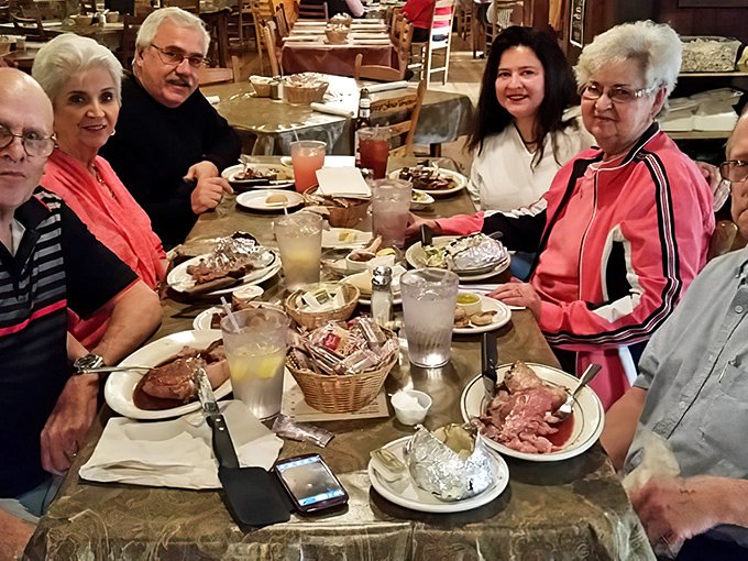 Multi-generational gatherings around these tables aren't just meals—they're memory-making sessions with beef as the honored guest.
