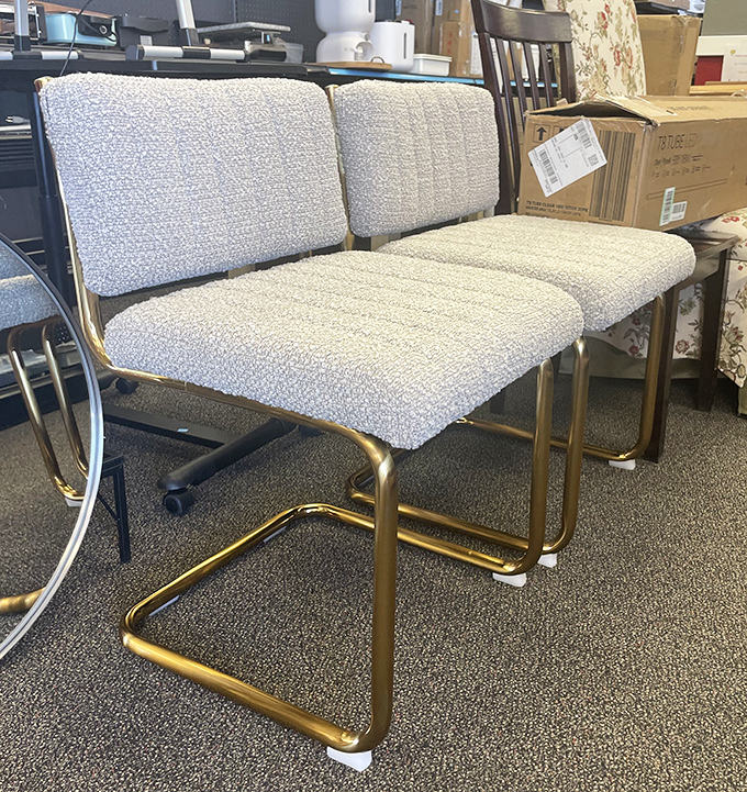 Gold-framed dining chairs that scream "I have excellent taste but refuse to pay retail." Perfect for those dinner parties where you casually mention "they're vintage."