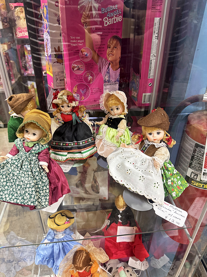 These dolls in their display case hold childhood dreams and tea party memories behind glass.