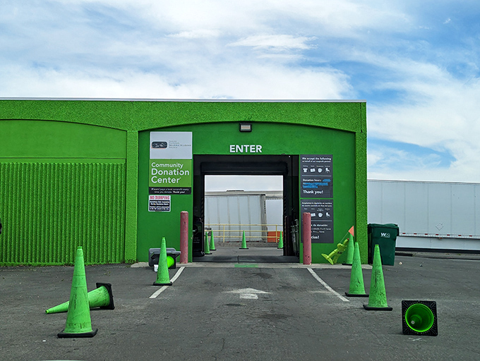 The bright green donation center welcomes gently-used contributions. Yesterday's closet cleanout becomes tomorrow's thrifting triumph in this cycle of secondhand sustainability.