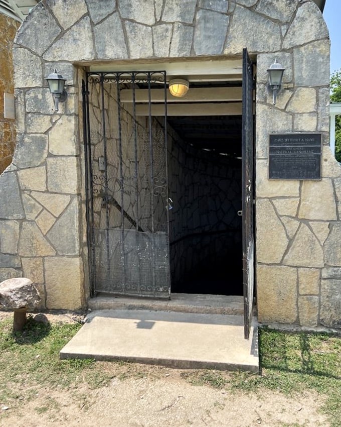 The gateway to underground adventure awaits. This stone entrance marks the boundary between the everyday world and a realm of geological marvels.