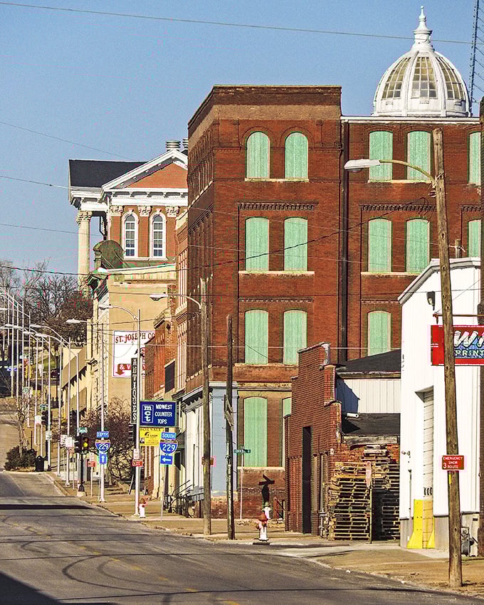 St. Joseph's downtown historic district showcases architectural details that modern buildings rarely attempt, crowned by a gleaming white dome against clear Missouri skies.