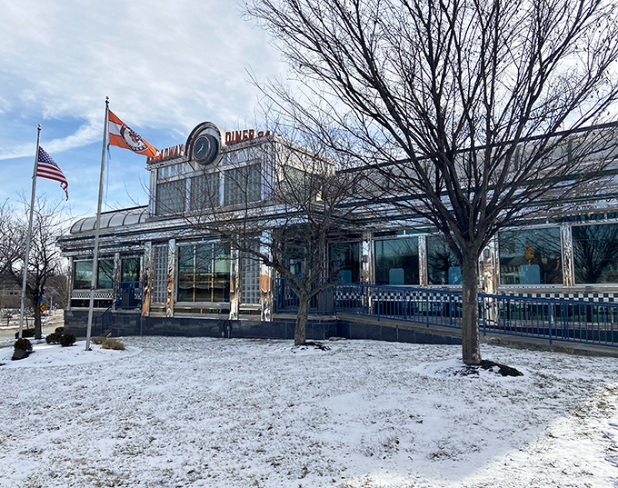 Even winter snow can't dim this diner's warm glow, proving that comfort food transcends all seasons beautifully.