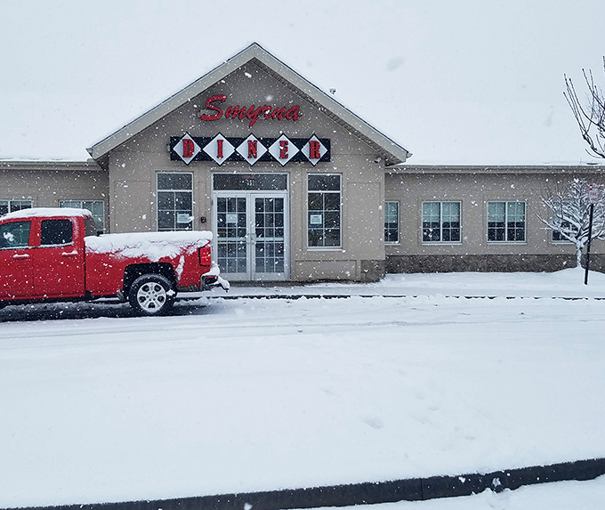 Even in winter's embrace, Smyrna Diner's warm glow beckons through falling snow. Some comfort foods taste even better when the weather turns cold.