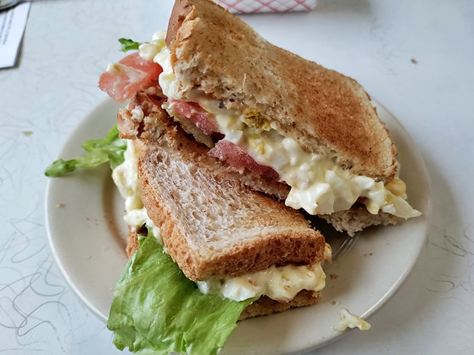 An egg salad sandwich that respects the classics. Perfectly toasted bread, generous filling, and lettuce that actually contributes more than just color. 