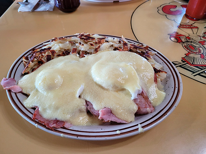 Eggs Benedict with a twist&mdash;ham piled high under perfectly poached eggs and hollandaise sauce that's practically drinkable. Breakfast nirvana achieved.