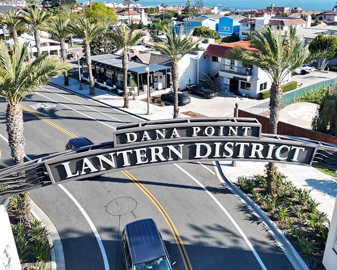 Palm trees stand sentinel over Dana Point's Lantern District, where coastal village charm and modern amenities create the perfect Southern California vibe.