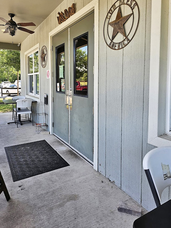The entrance might be humble, but those Texas stars promise big flavor. Like a barbecue speakeasy, only the worthy know what treasures await inside.